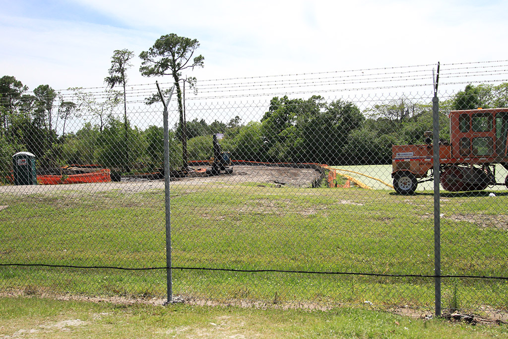 Construction staging area and access road behind the Magic Kingdom