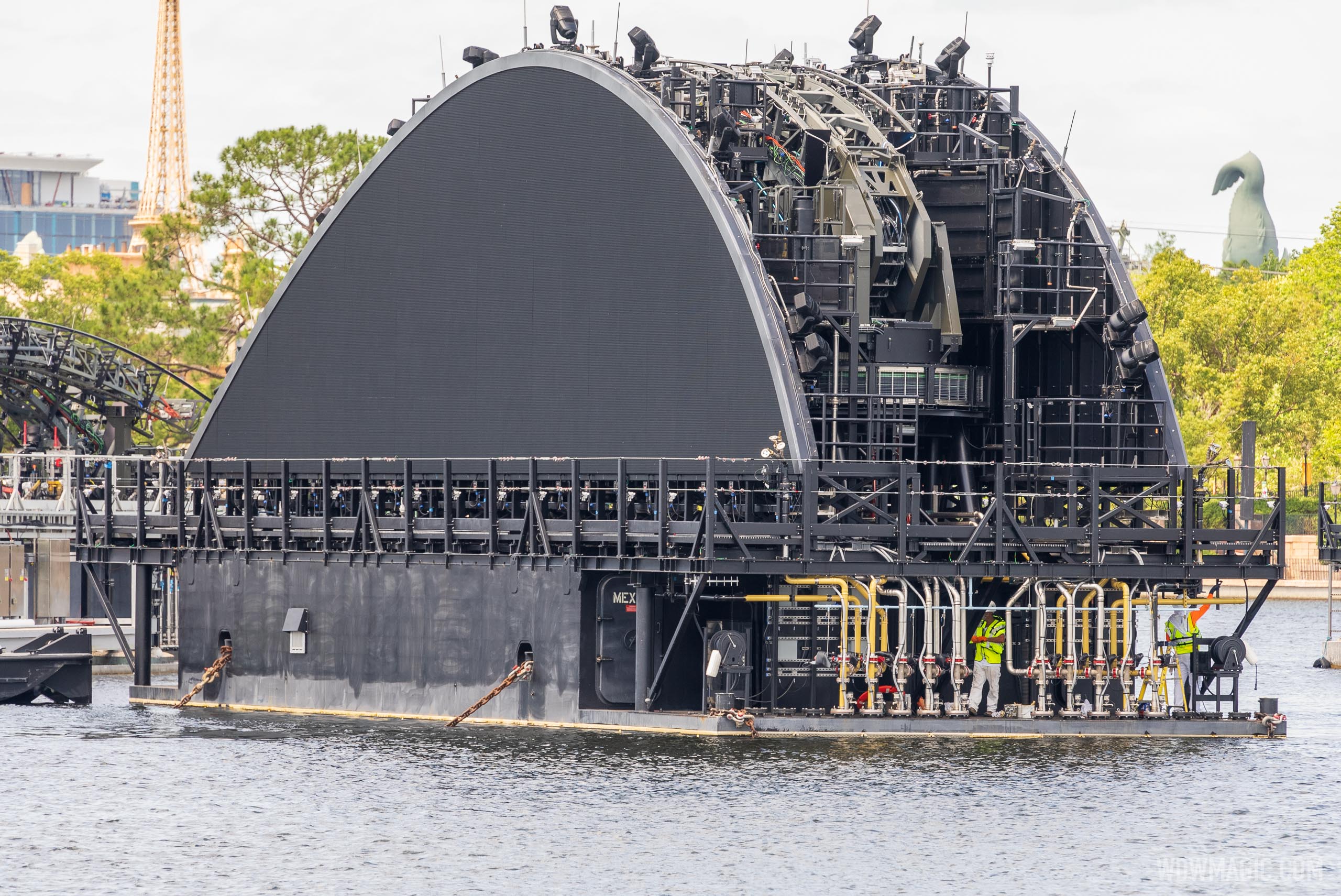 Painting the Harmonious show barges continues at EPCOT